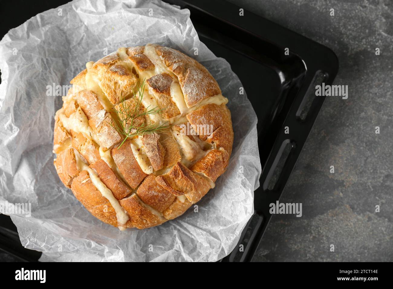 Freshly baked bread with tofu cheese on grey table, top view Stock ...