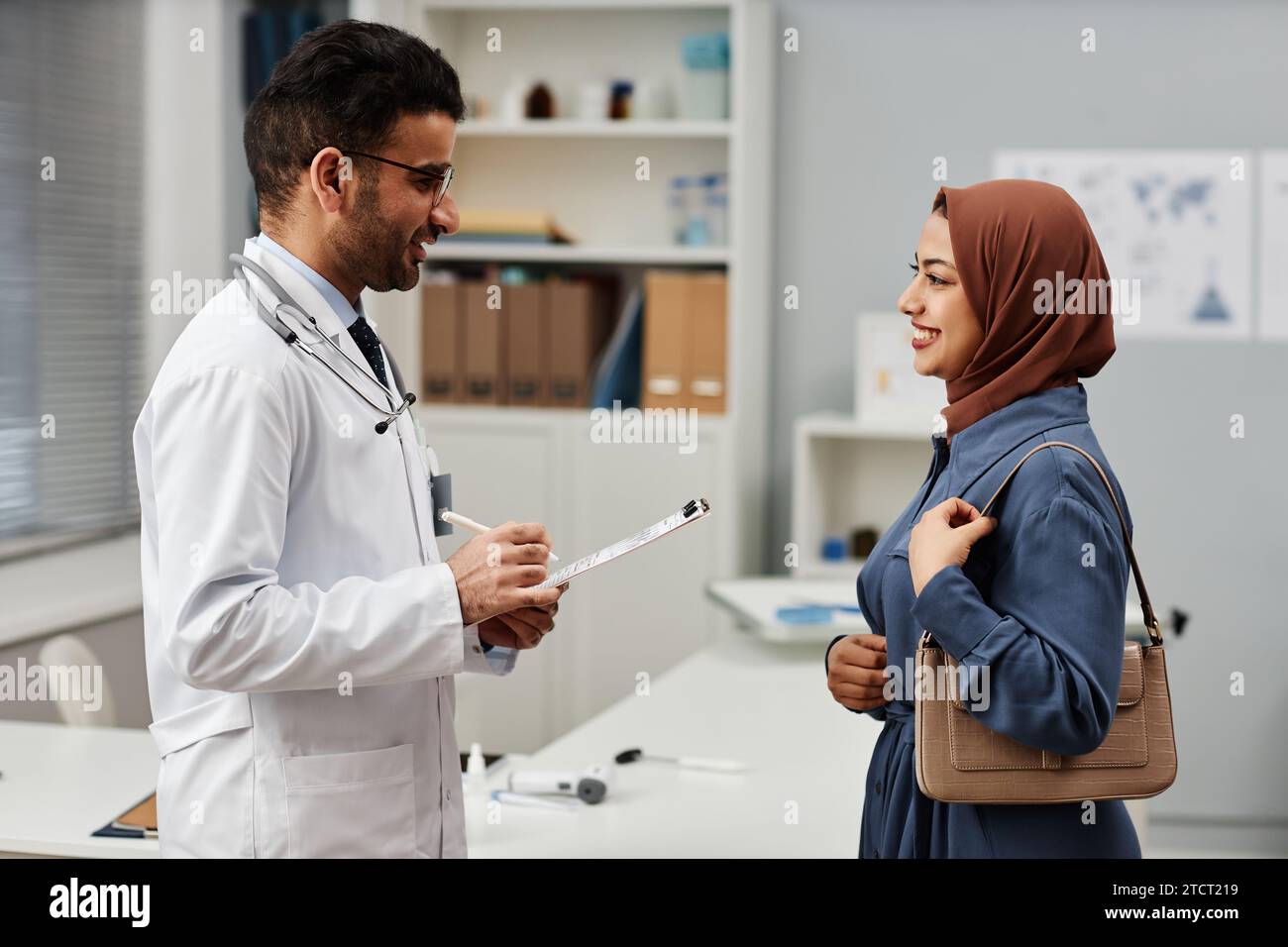 Muslim Doctor and Patient in Clinic Office Stock Photo - Alamy