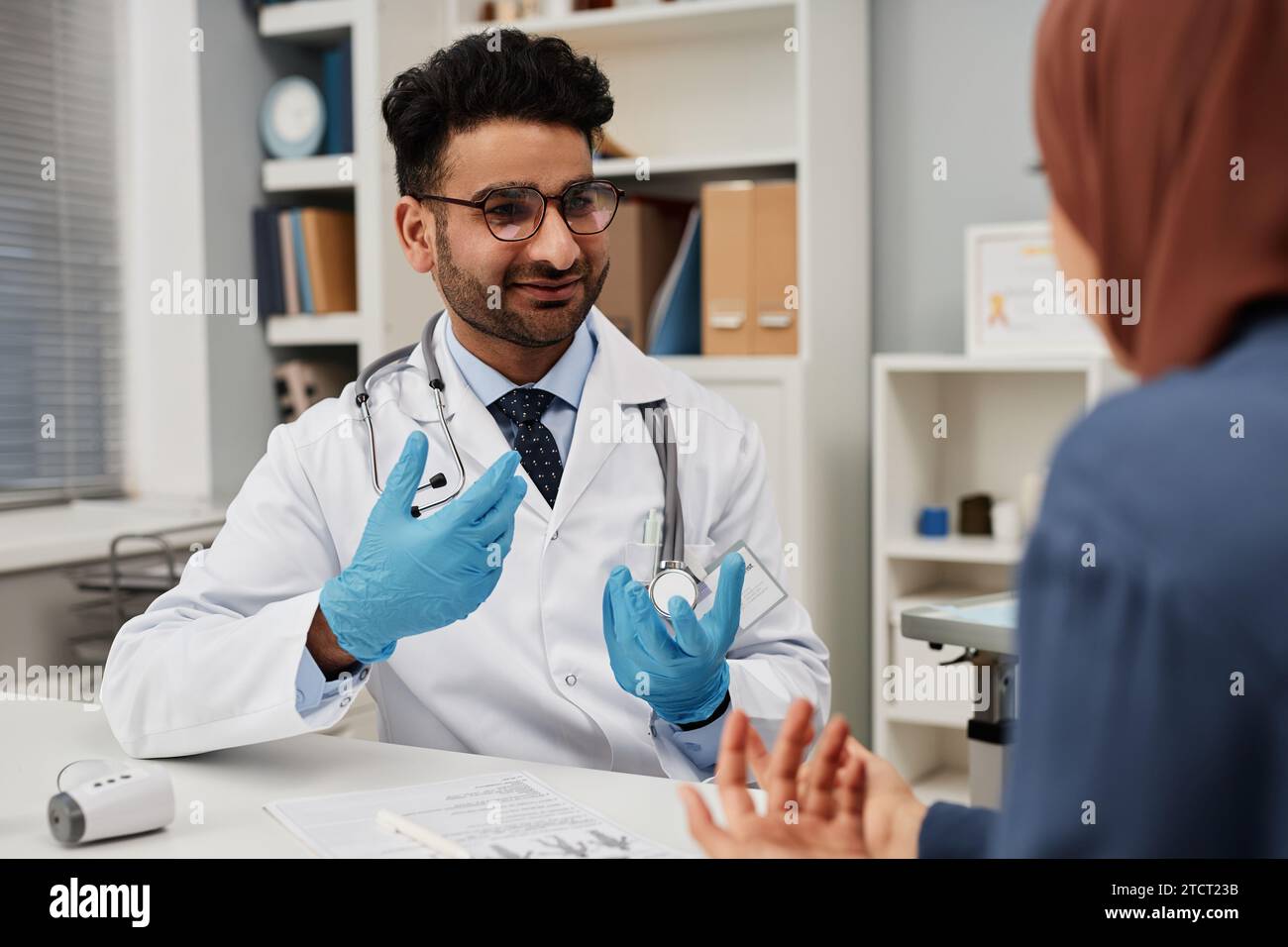 Muslim Physician Explaining Treatment to Patient Stock Photo - Alamy