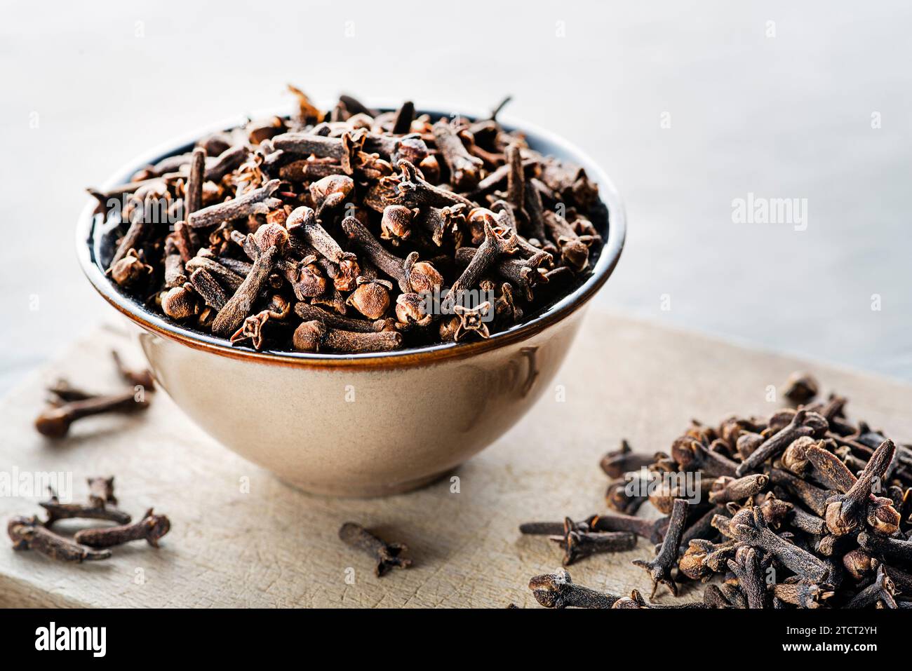 Cloves spice. Some dried cloves on grey background spice concept close ...