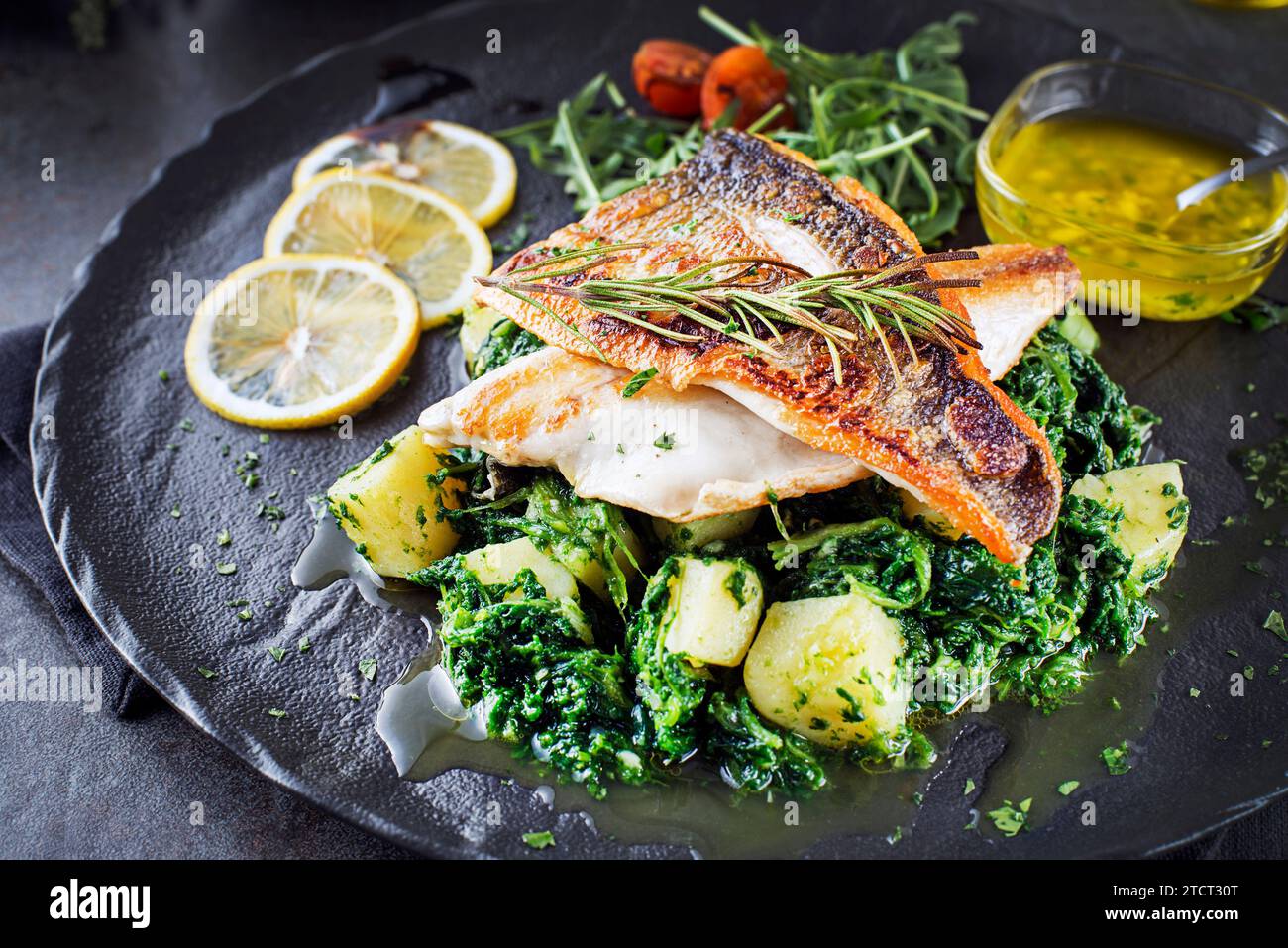 Fish dish - fried sea bass fillet and boiled Swiss chard with potatoes ...