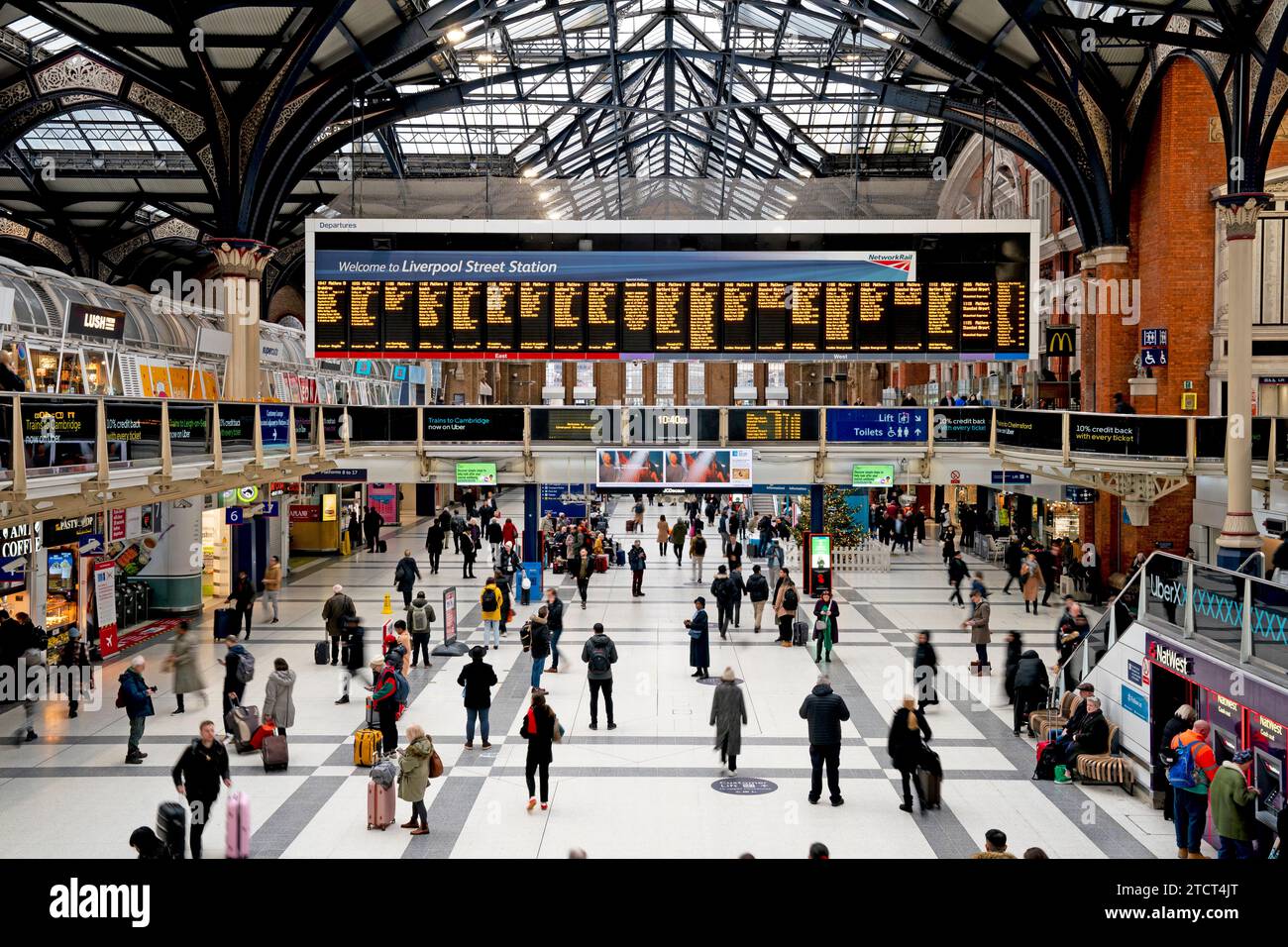Passengers wait on the concourse at Liverpool Street station in London ...