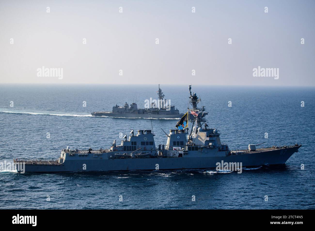 The guided-missile destroyer USS Mason (DDG 87) sails alongside the ...