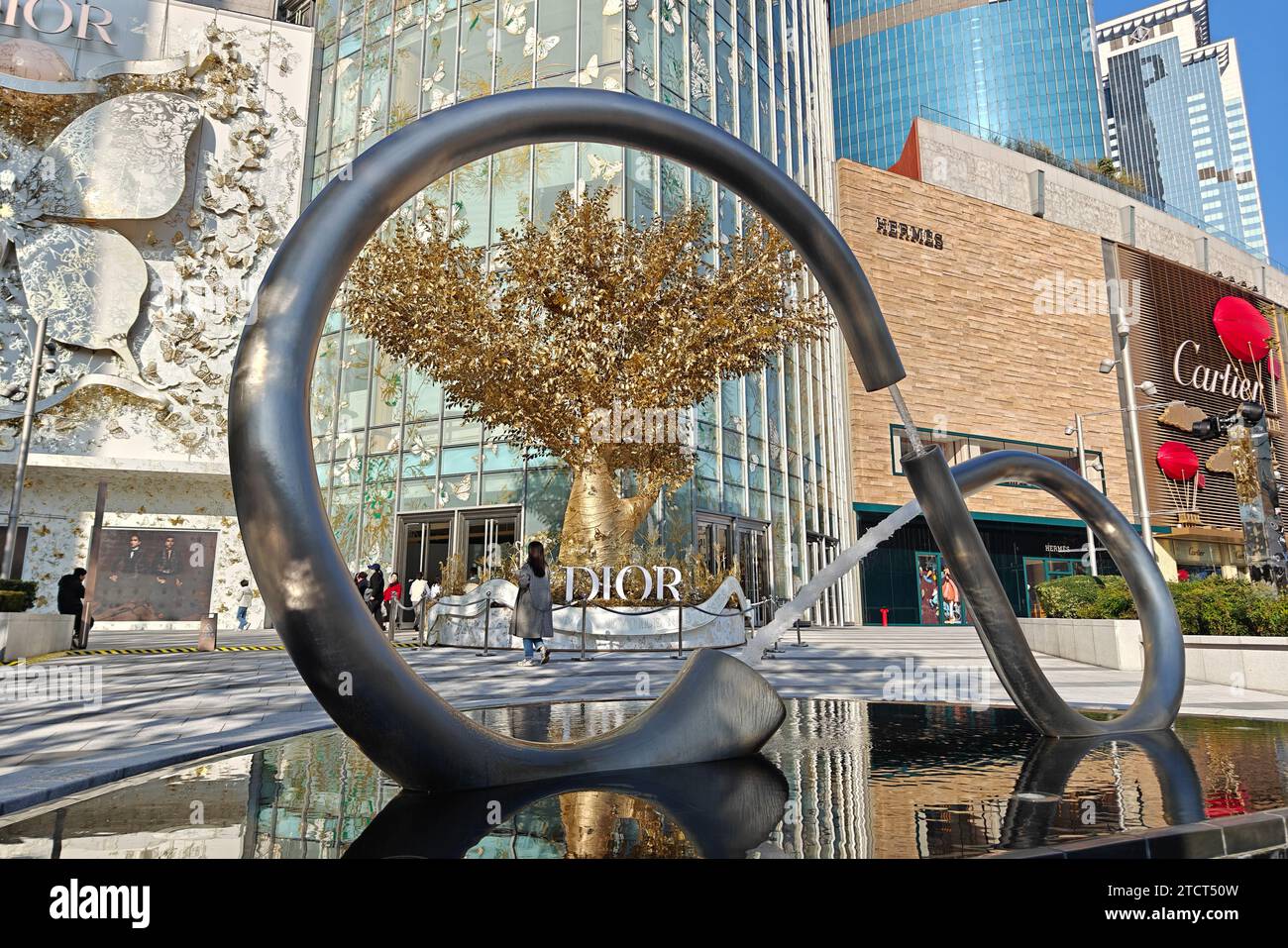 SHANGHAI, CHINA - DECEMBER 14, 2023 - People look at the DIOR Christmas ...