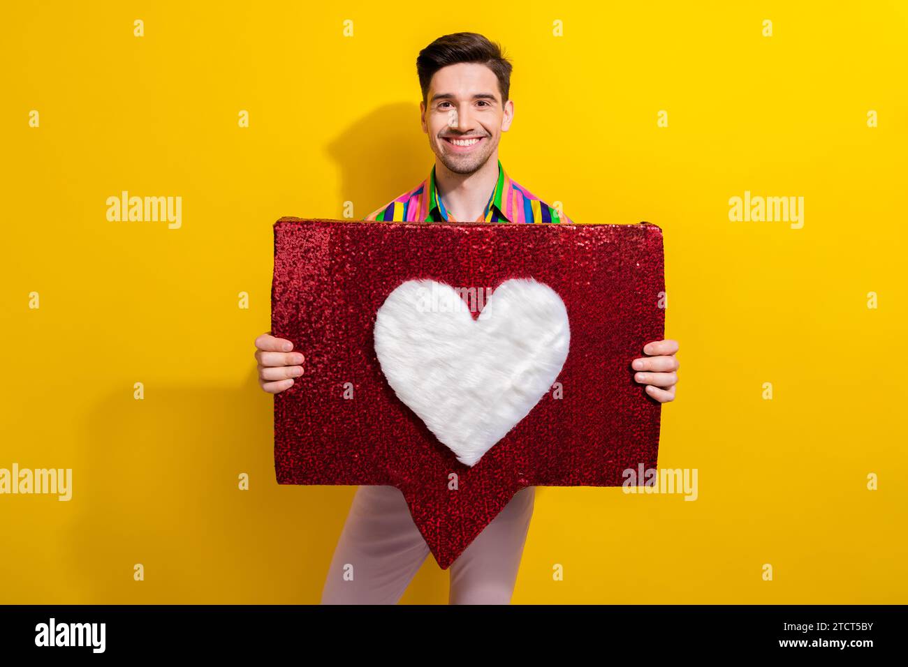 Photo of the guy in retro shirt holding bright collage button like ...