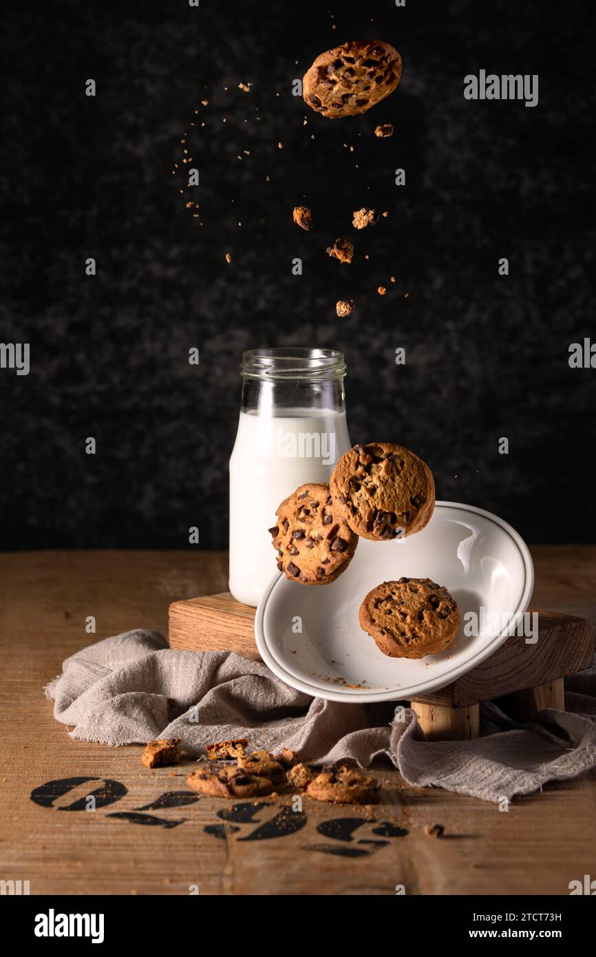 White milk and chocolate chips fall from the air (levitation Stock ...