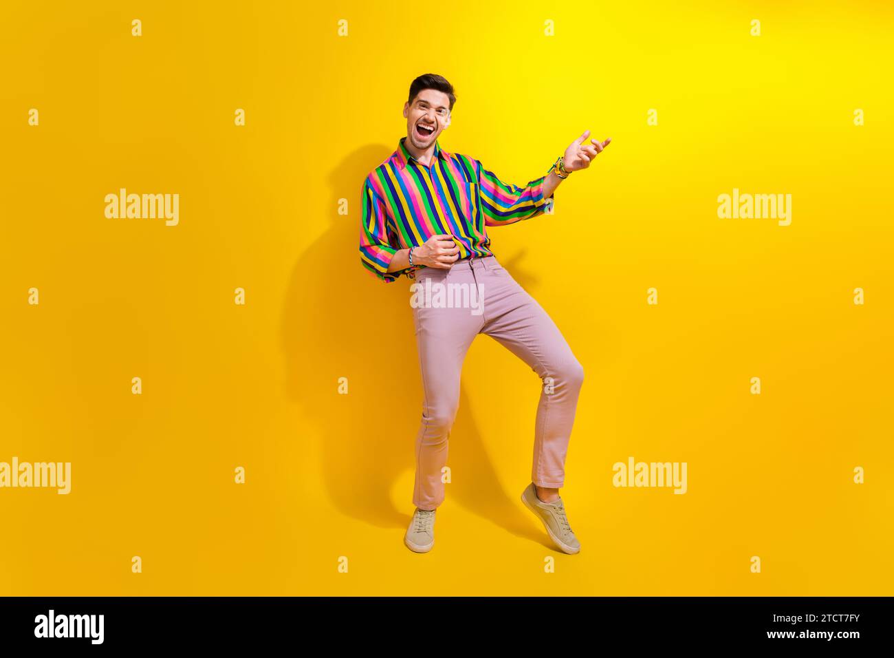 Full body photo of crazy man hold invisible guitar playing musical ...