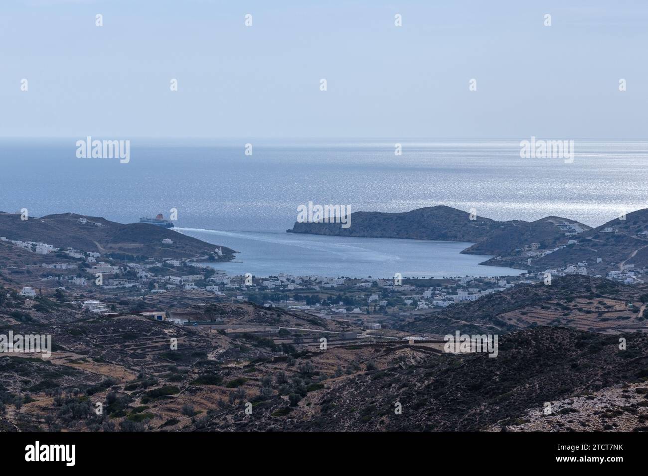 Beautiful panoramic view of the port of Ios Greece and a ferry boat ...