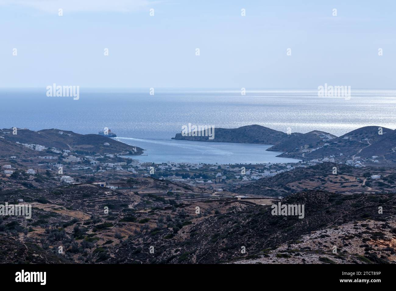 Beautiful panoramic view of the port of Ios Greece and a ferry boat ...