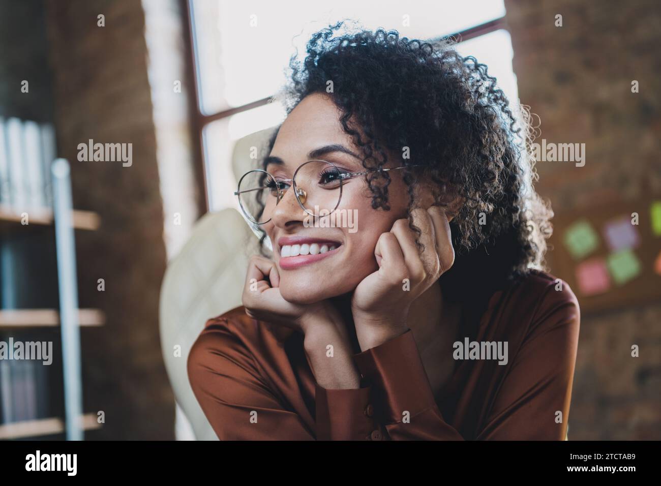 Photo of pretty cheerful corporate lady sit chair hands touch cheeks ...