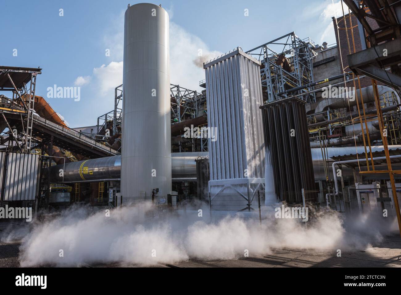 Steam around the cooling system in the smelter Stock Photo - Alamy