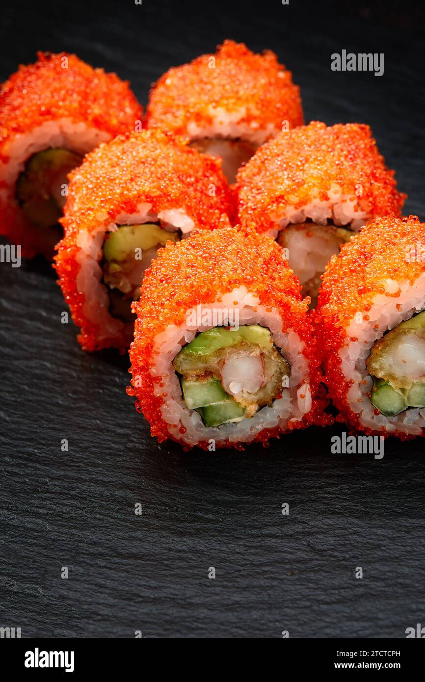 Sushi rolls california with snow crab, cream cheese, cucumber, sesame seeds and masago caviar on ...
