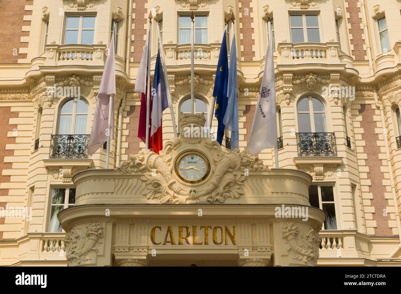 Exterior front facade and elaborate entrance doorway with Rolex clock ...