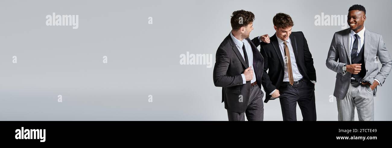 handsome jolly diverse friends in business elegant attires smiling ...