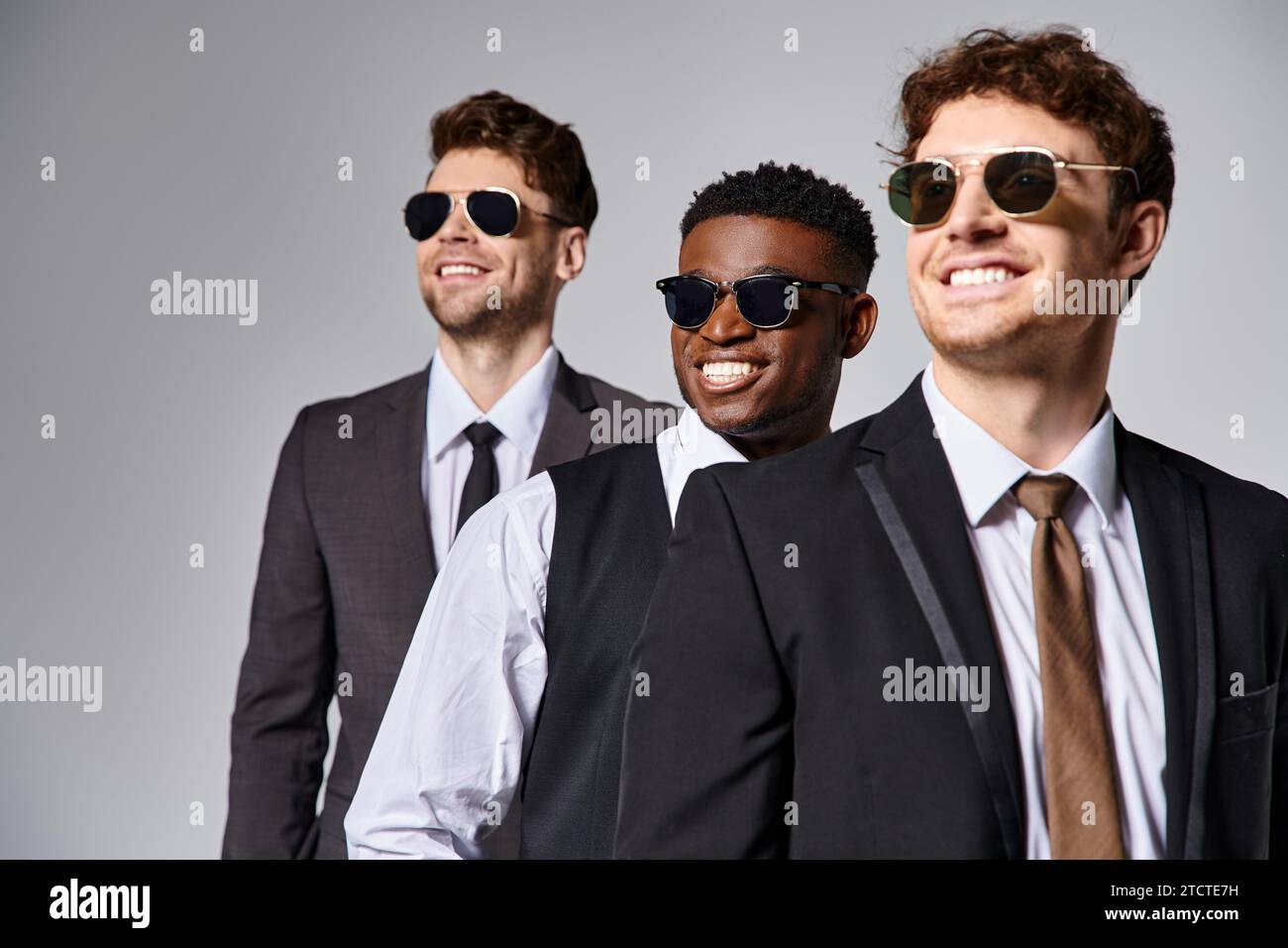 cheerful diverse friends in business casual attire with sunglasses ...