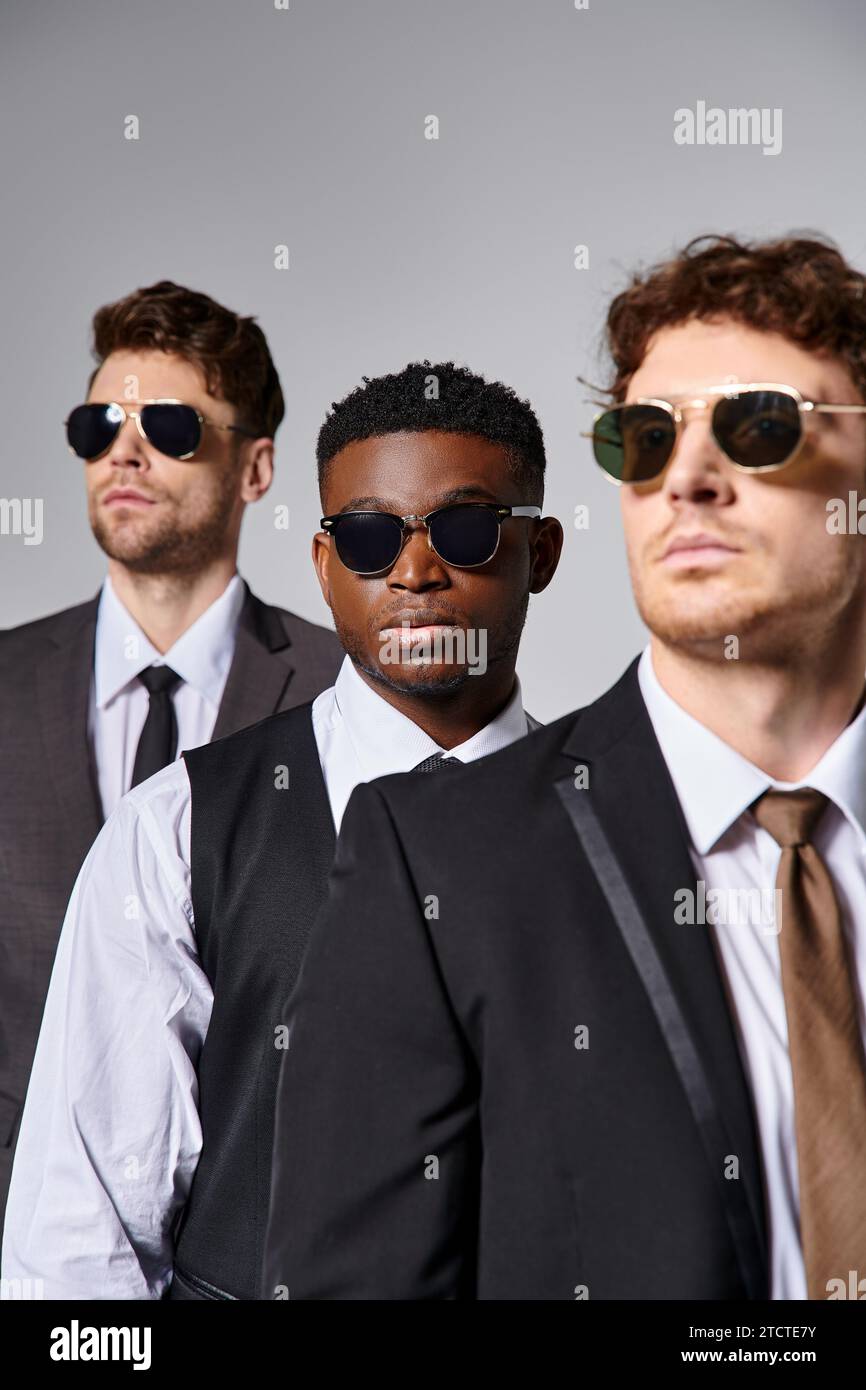 handsome multiracial male models in elegant smart suits with sunglasses ...