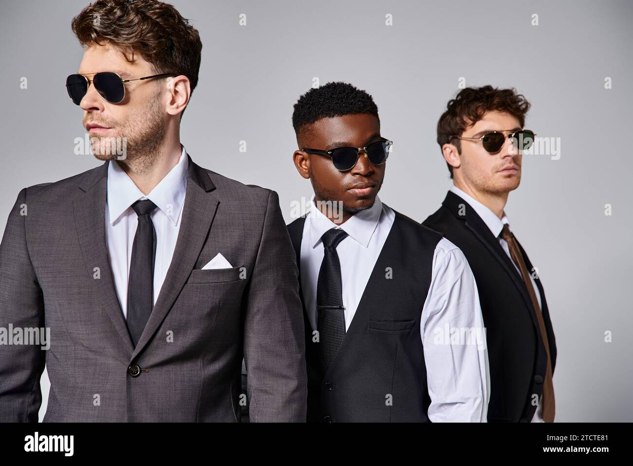 good looking multiracial male models in elegant smart suits with ...