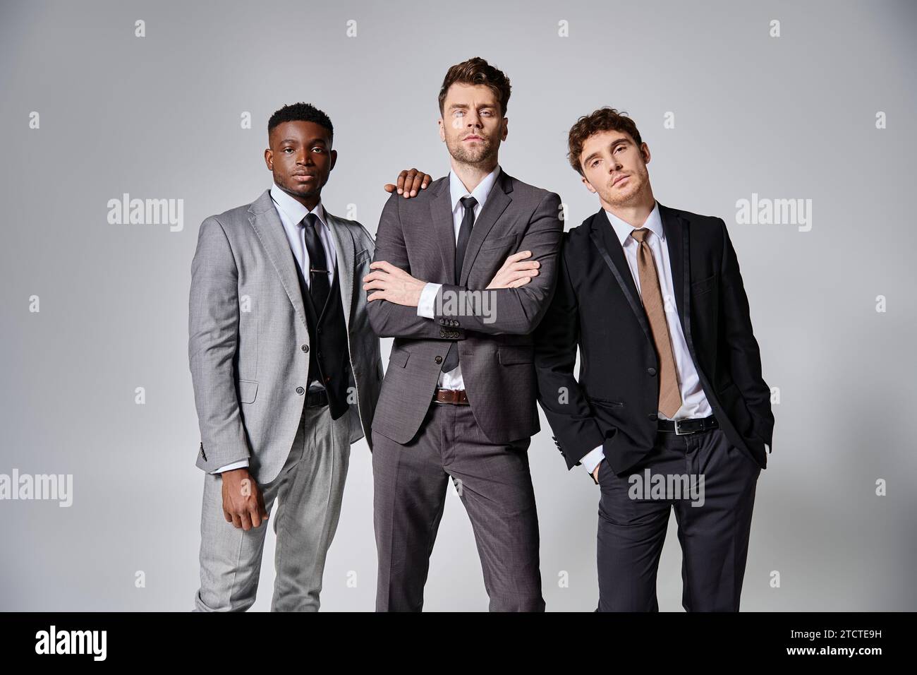 alluring young multicultural male models in business casual attires ...