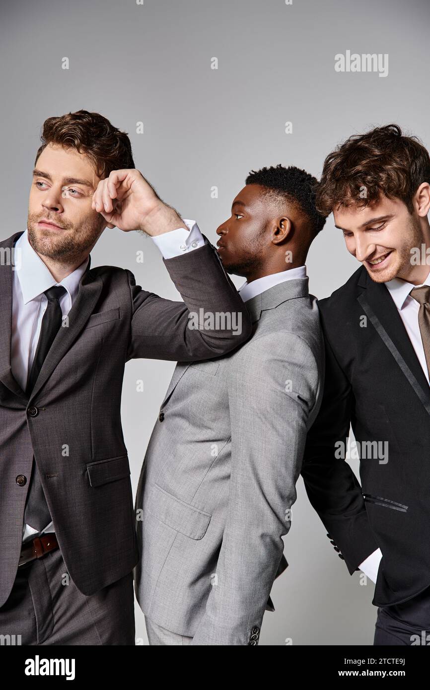 jolly multicultural men in business casual outfits posing on gray ... jolly multicultural men in business casual outfits posing on gray ...