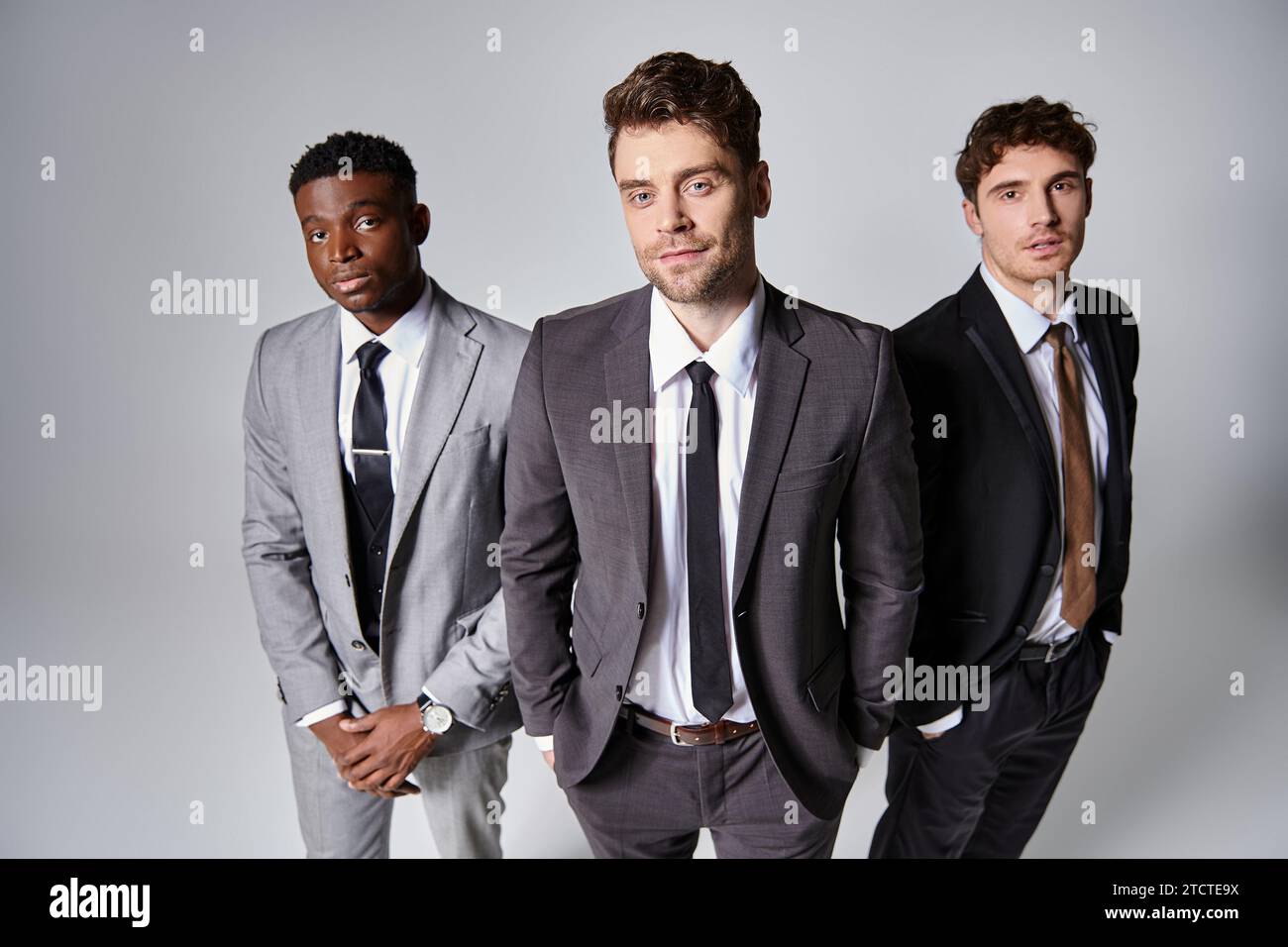 attractive young multicultural male models in business casual attires ...