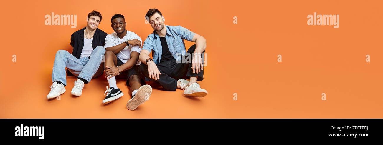 Three men sitting on street hi-res stock photography and images - Alamy