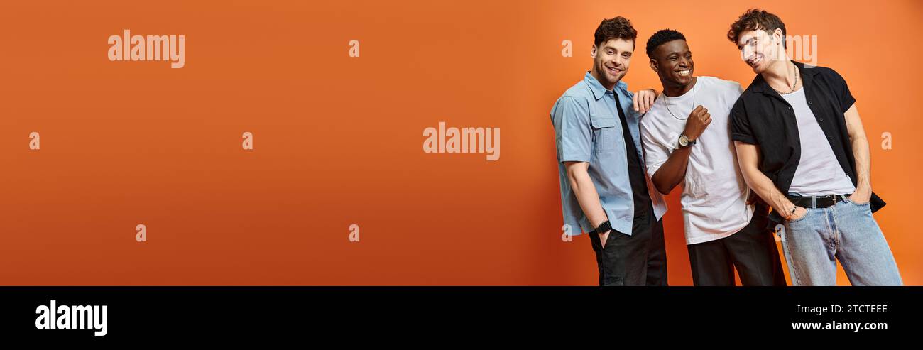 happy multicultural men in urban casual outfits smiling cheerfully ...