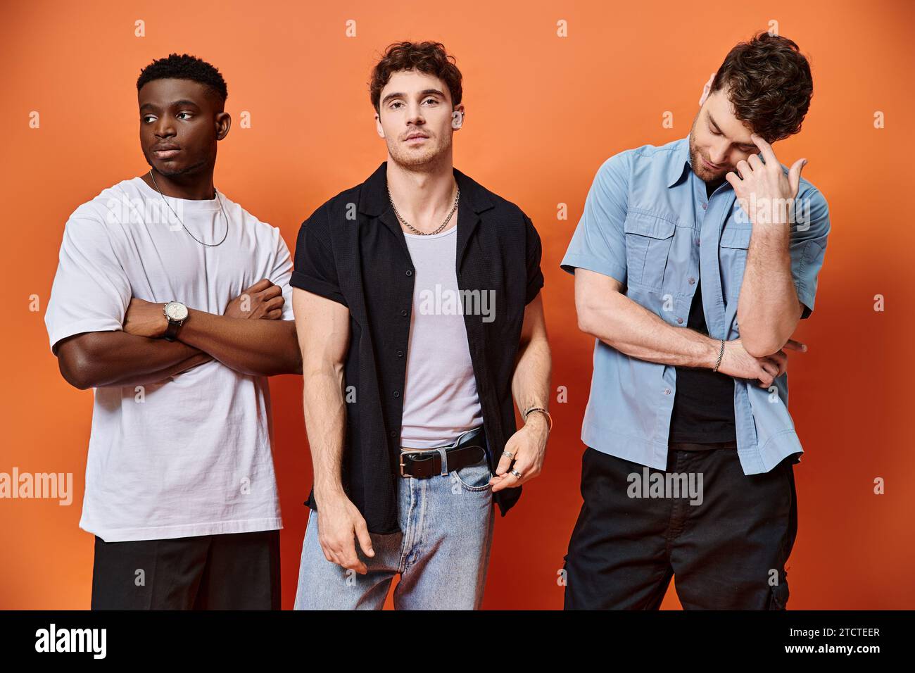 appealing multiracial male models in stylish urban clothes posing on ...