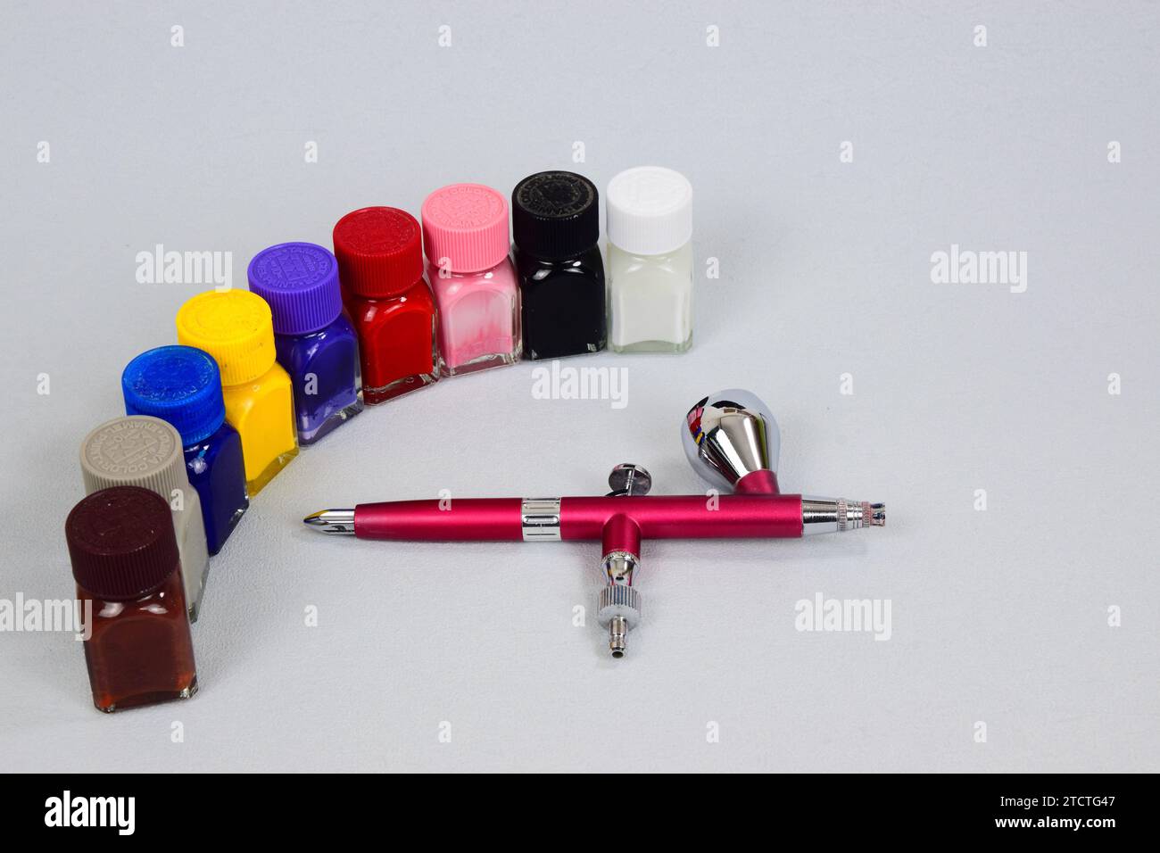 An airbrush and paints Stock Photo - Alamy