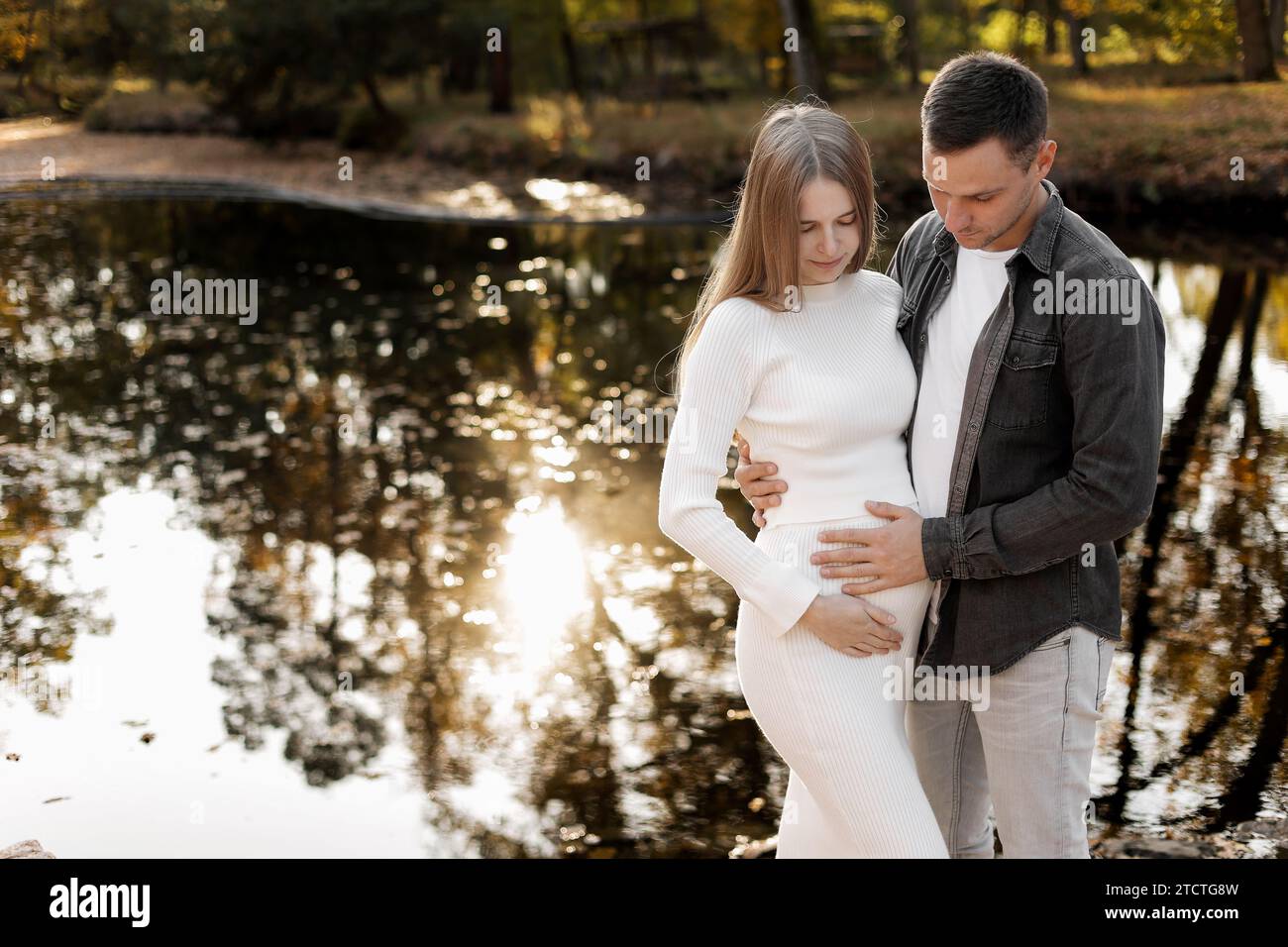 Family day. Stylish marriage pregnant couple waiting for baby. Man is ...