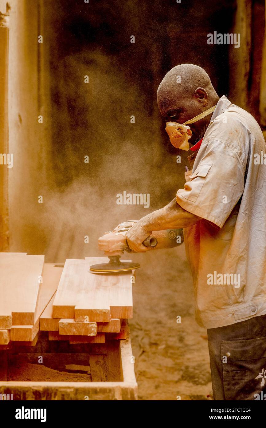 Worker sanding planks in a Bukavu workshop, DRC Stock Photo - Alamy