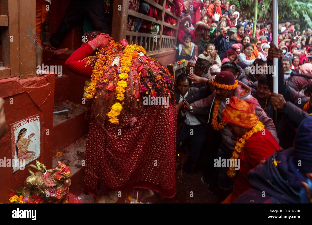 Dhading, Bagmati, Nepal. 14th Dec, 2023. A devotee carrying the goddess ...