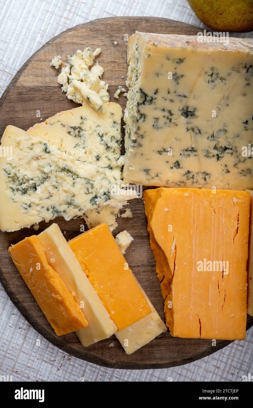 English cheeses collection, mature and coloured cheddar cheese and semi ...