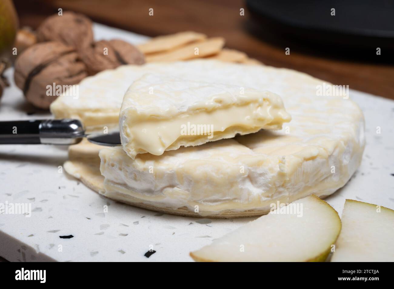 French soft Cremeux de Normandie cheese, soft creamy cheese with white ...