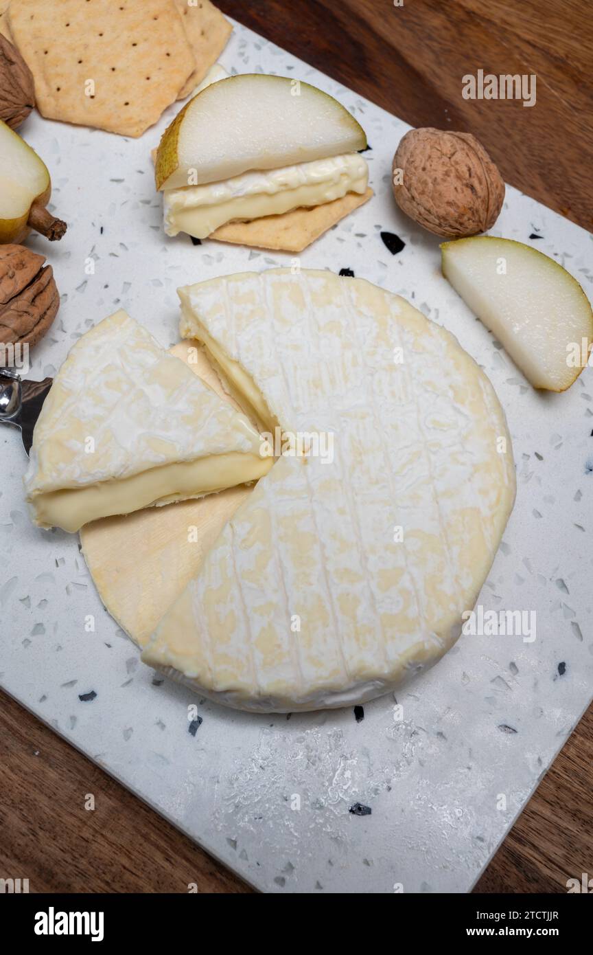 French soft Cremeux de Normandie cheese, soft creamy cheese with white ...