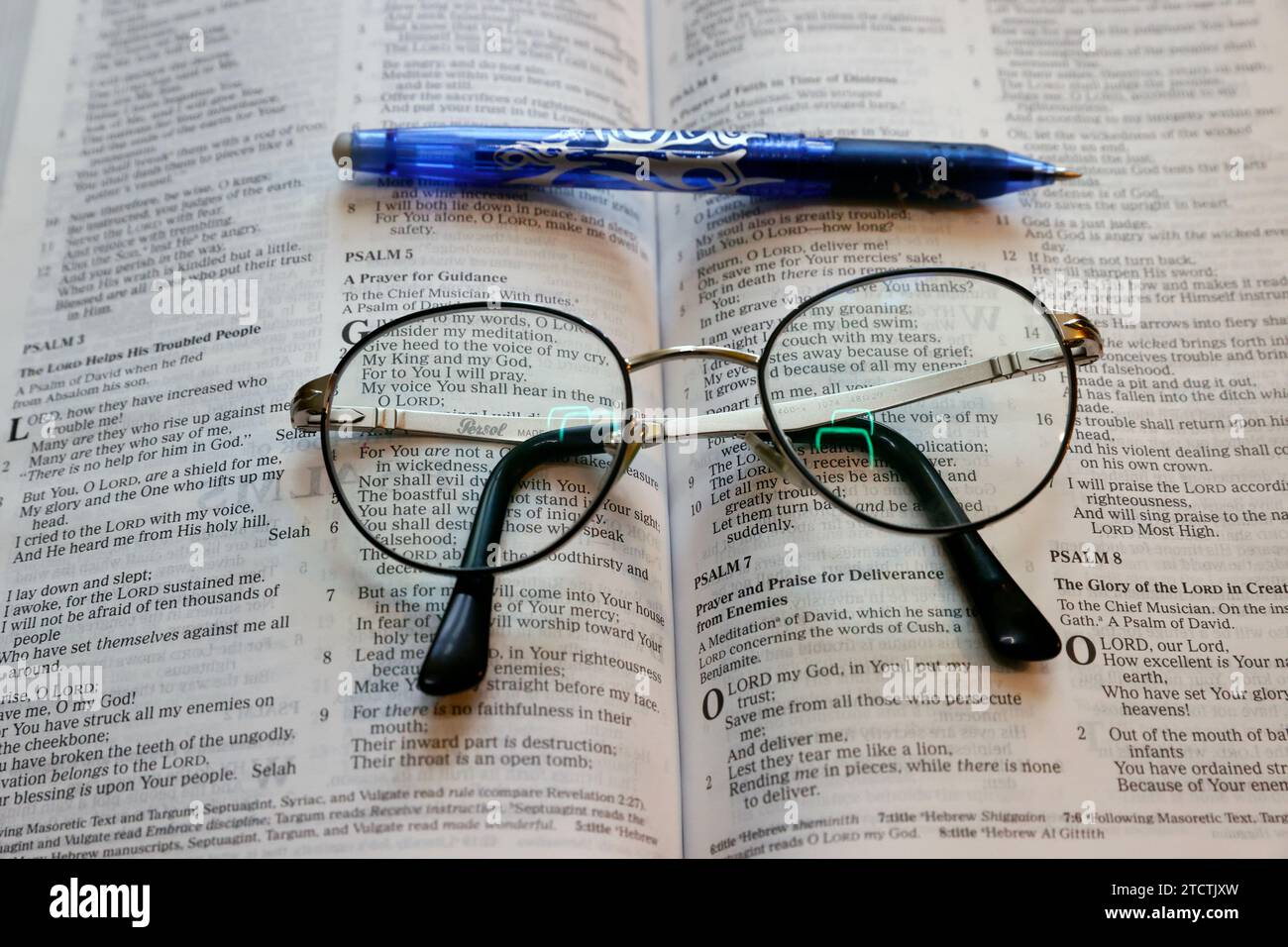 Bible study. Open bible with glasses Stock Photo - Alamy