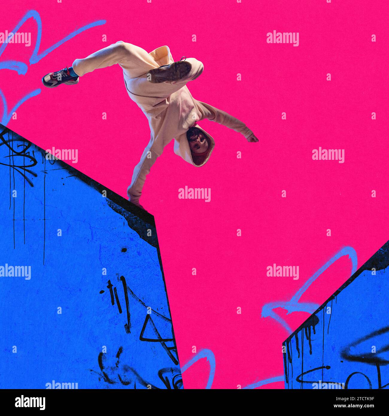 Extreme and dangerous activity. Young man doping parkour trick outdoors ...