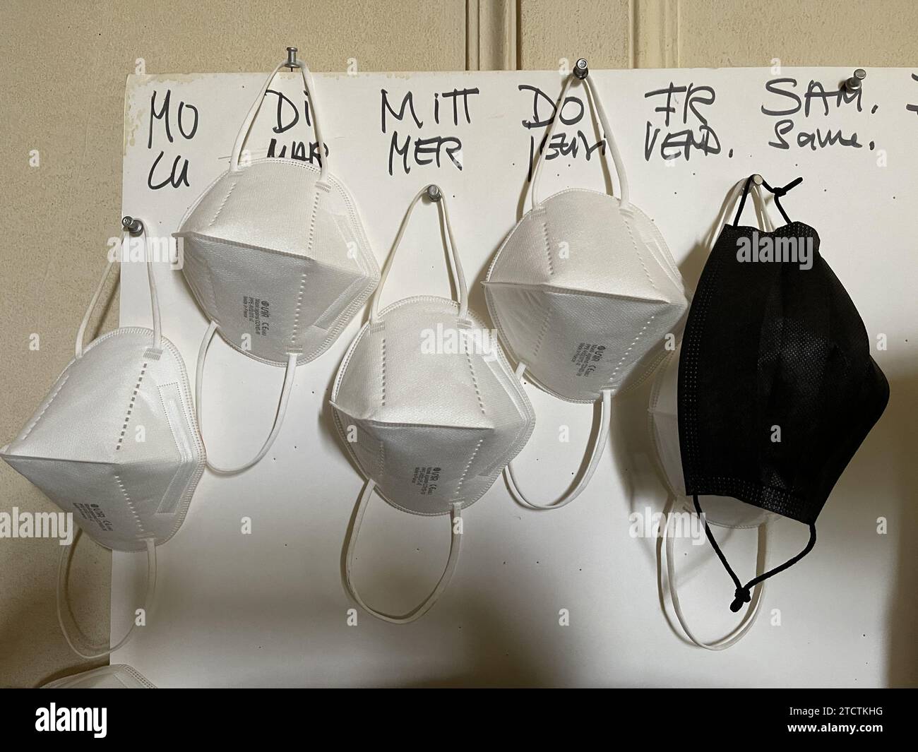 Face masks worn during covid-19 pandemic hanging in an apartment, Paris ...