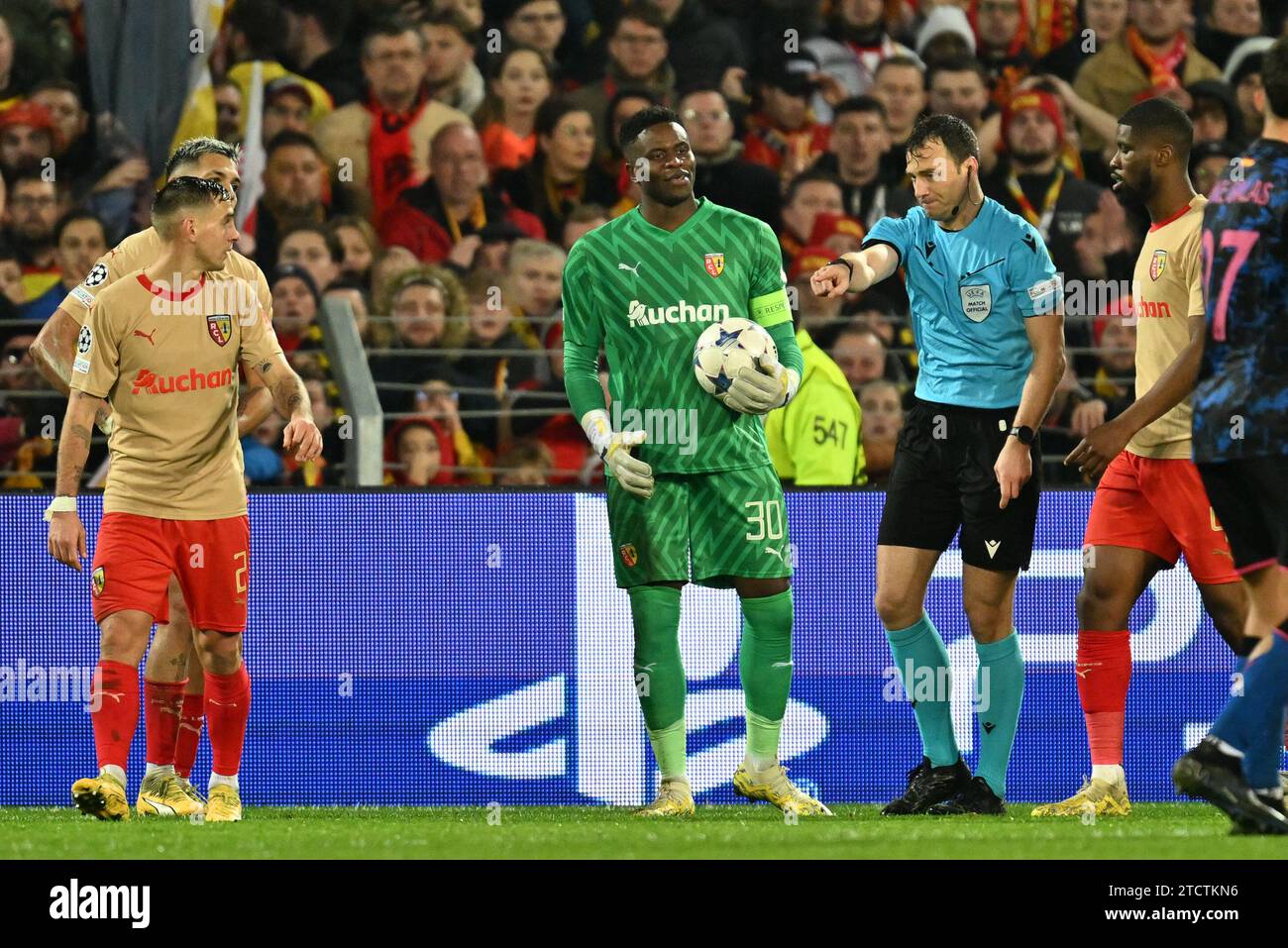 goalkeeper Brice Samba (30) of RC Lens and referee Felix Zwayer of ...