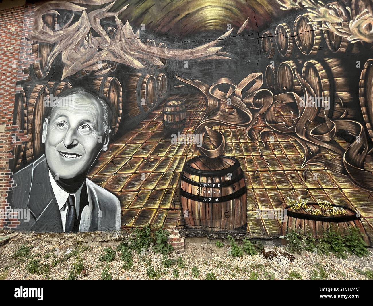 Wall art depicting French actor Bourvil and barrels of liquor in La ...