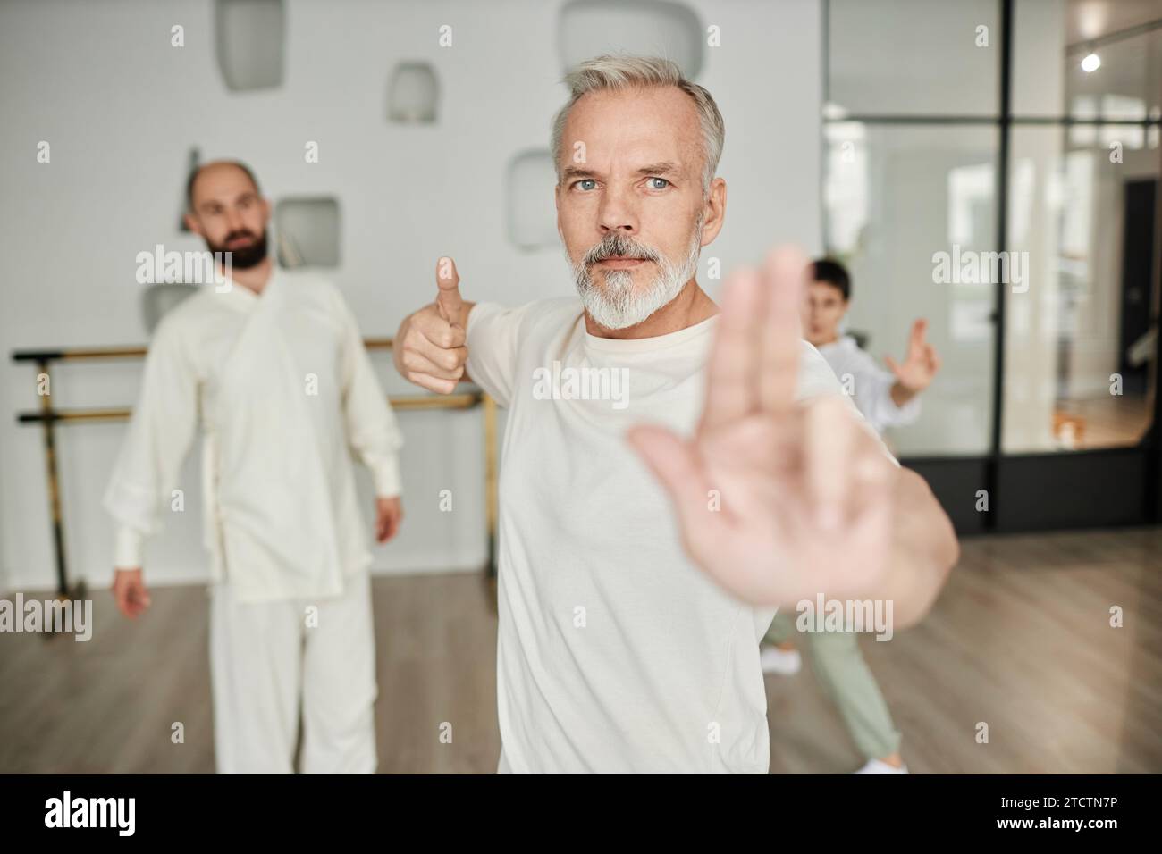 Aged Male Person Doing Exercise during Qigong Class Stock Photo - Alamy