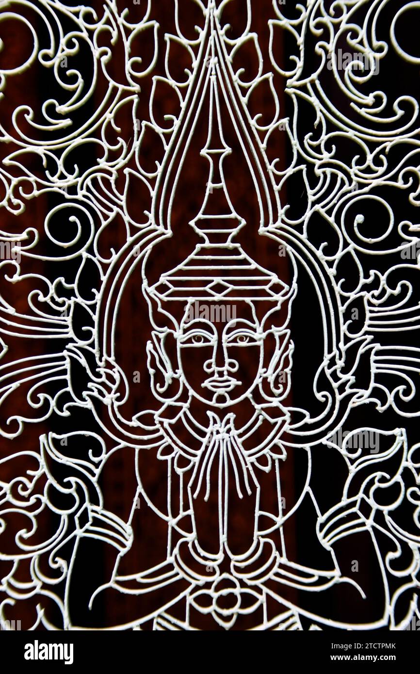Royal palace complex. Metal mesh gate with a representation of Buddha ...
