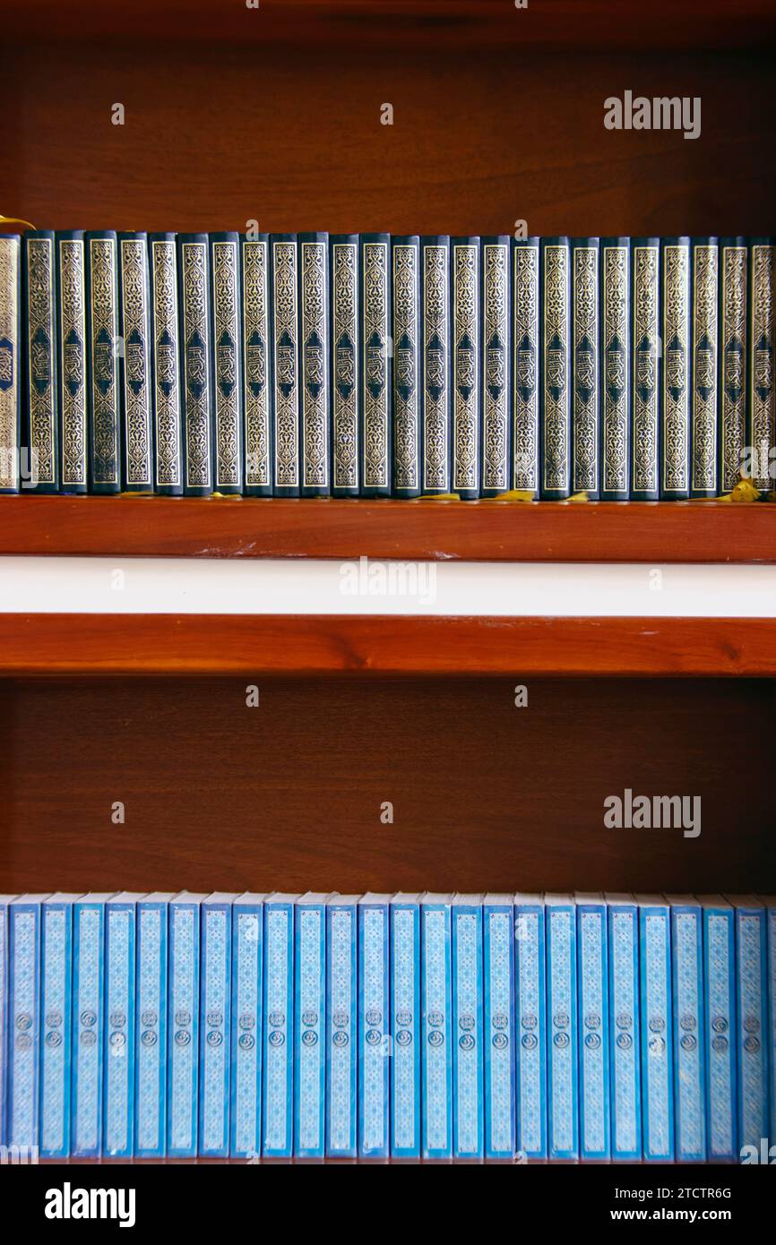 Row of Holy Quran ( Kuran ) books in a mosque. Islamic symbol. Phnom ...