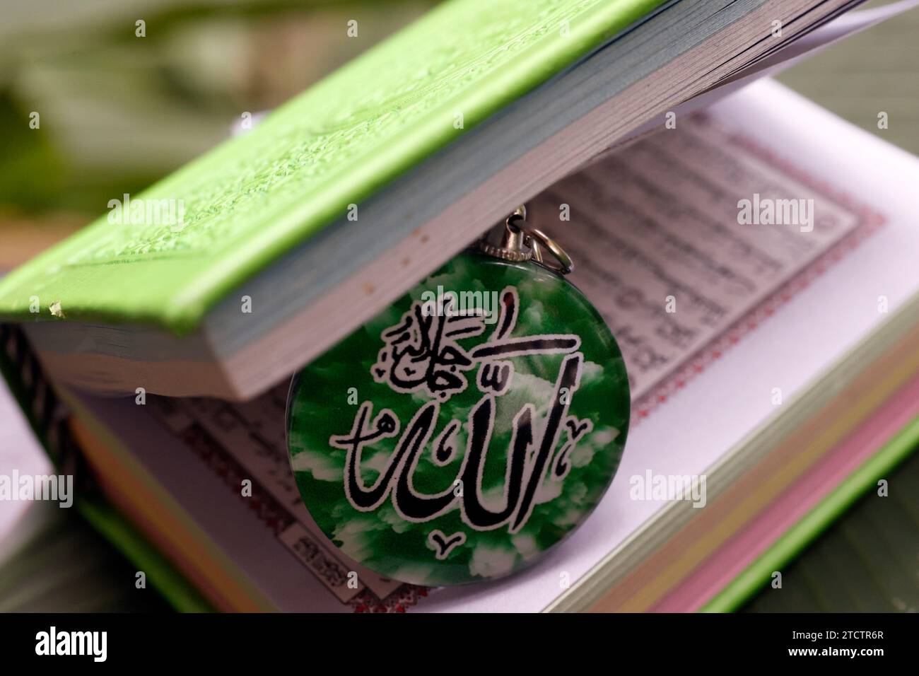 The Quran, holy book of Muslims from God with Allah monogram. Symbols ...