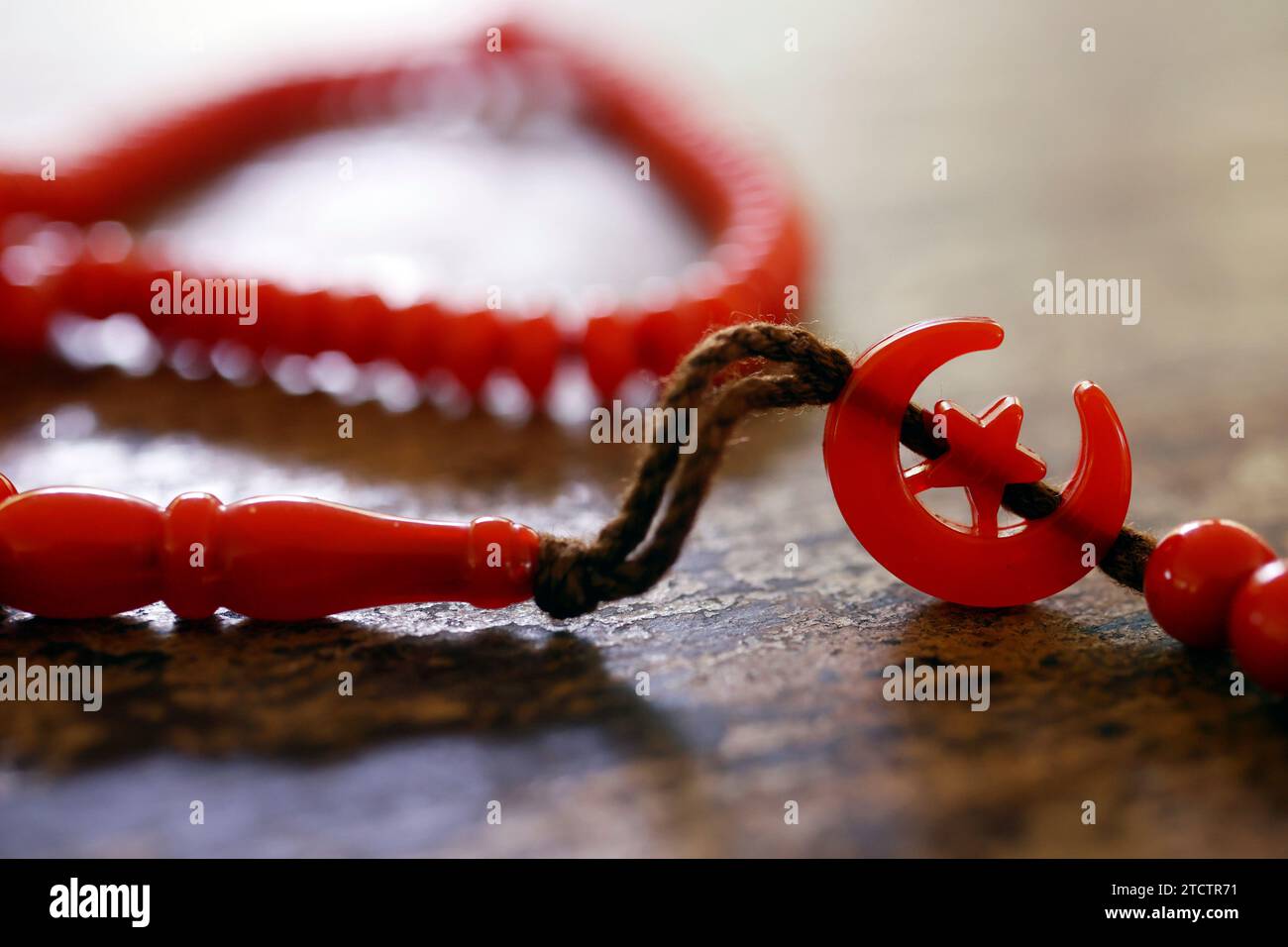 Red tasbih ( muslim prayer beads ) with star and crescent. Symbol of ...