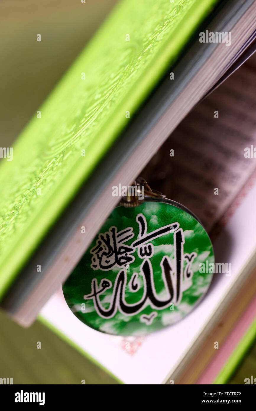 The Quran, holy book of Muslims from God with Allah monogram. Symbols ...