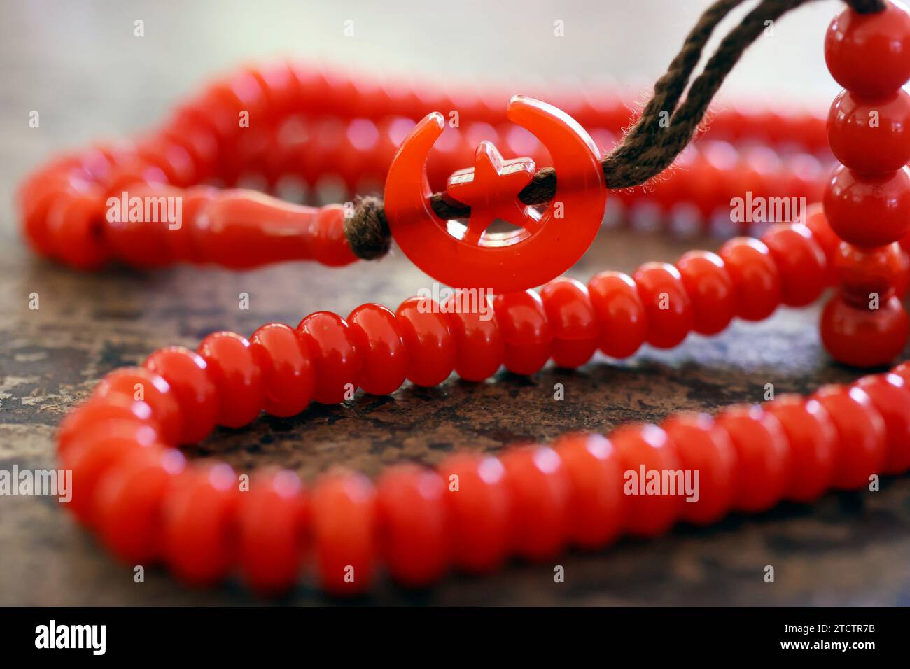 Red tasbih ( muslim prayer beads ) with star and crescent. Symbol of ...