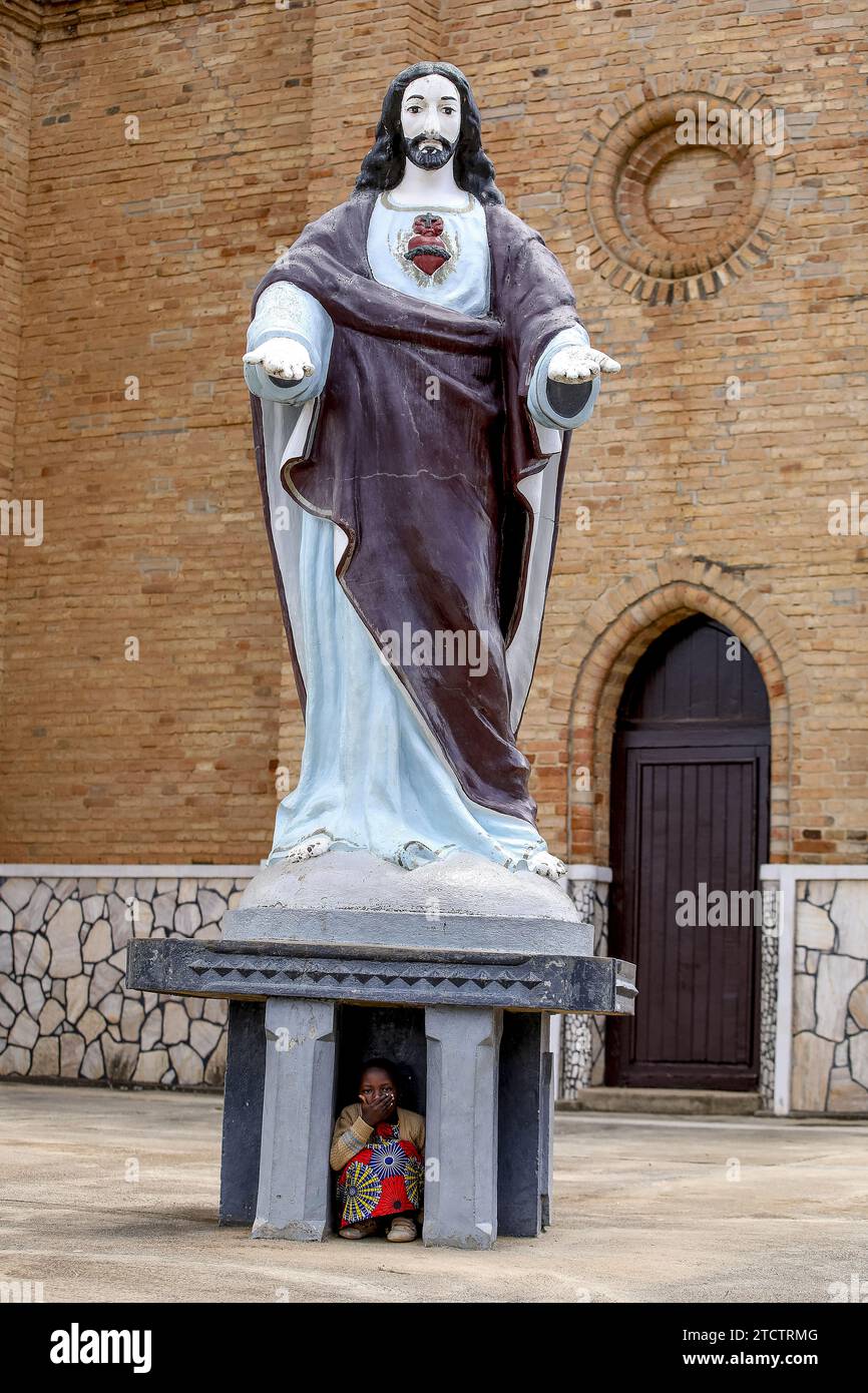 Child under a Jesus Christ statue outside the cathedral basilica of Our ...