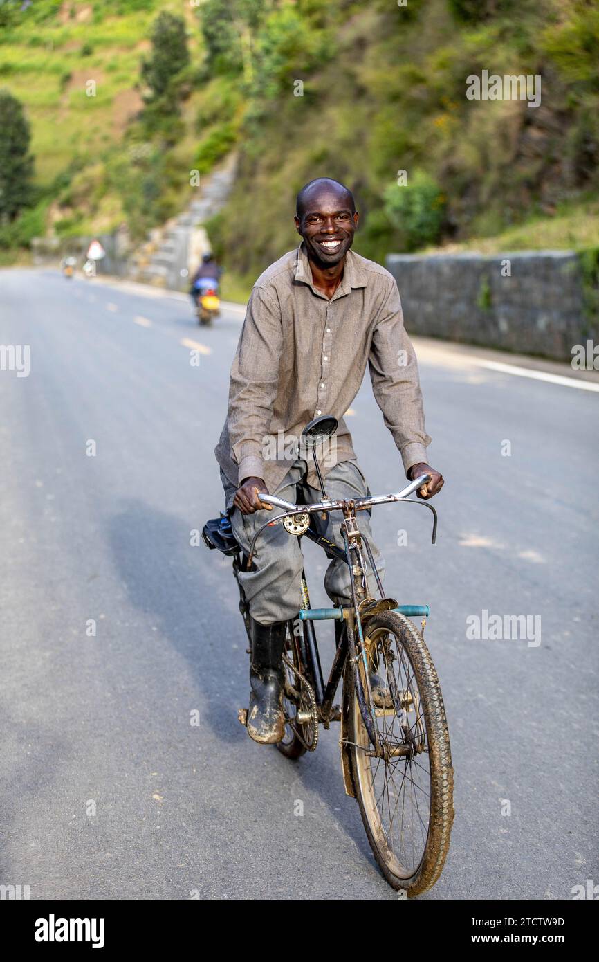 Uphill cycling in Western Rwanda Stock Photo - Alamy