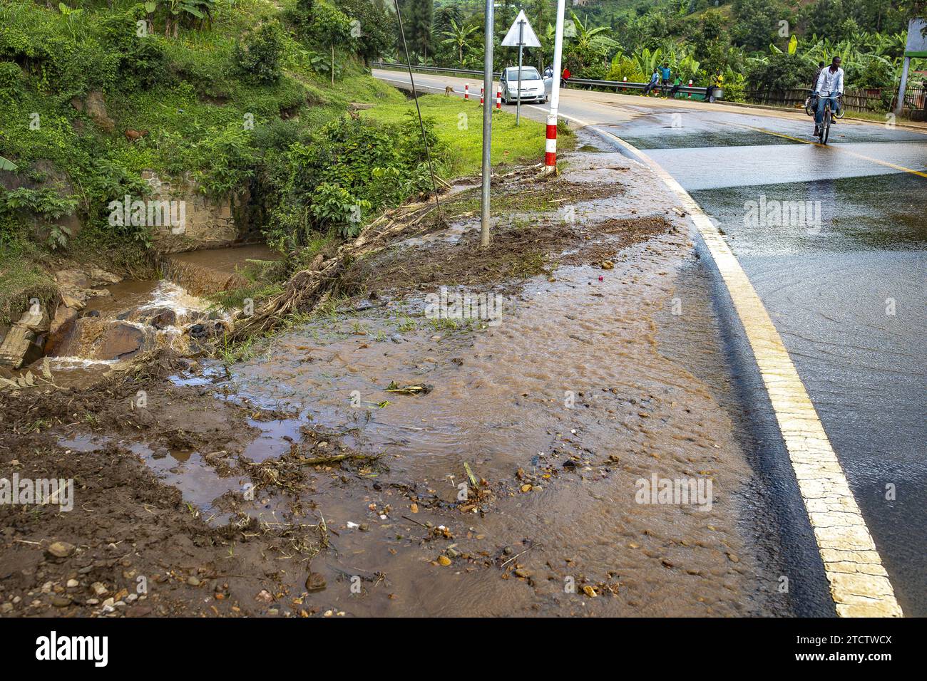 Road flooded and damaged by mudslides in western province, Rwanda Stock ...