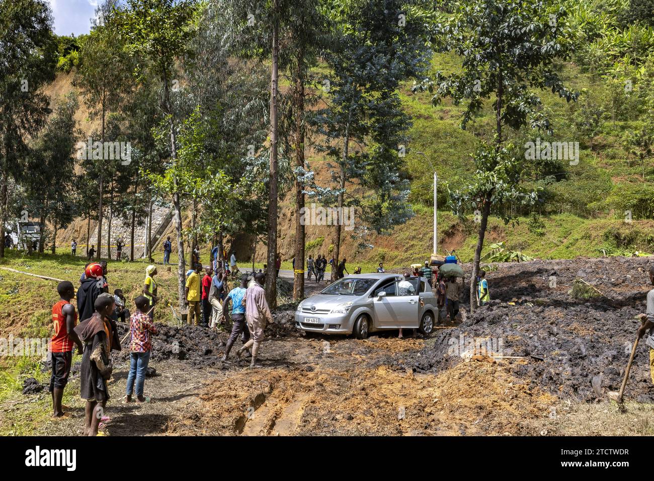 Muddy pathway along a road blocked by mudslides in western province ...